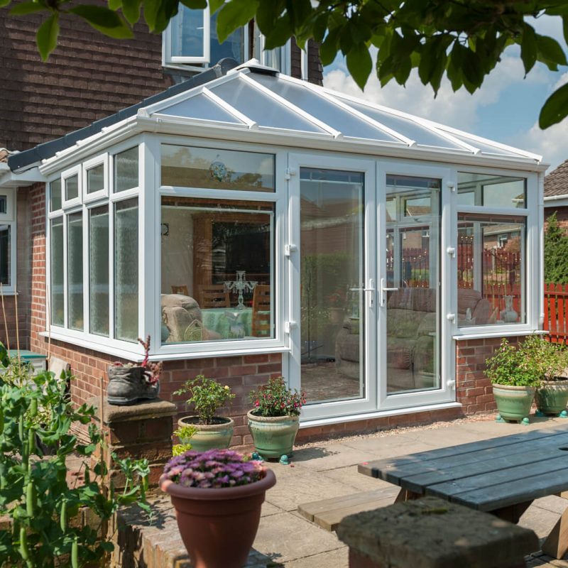 Small White UPVC Conservatory with French Doors by Eden